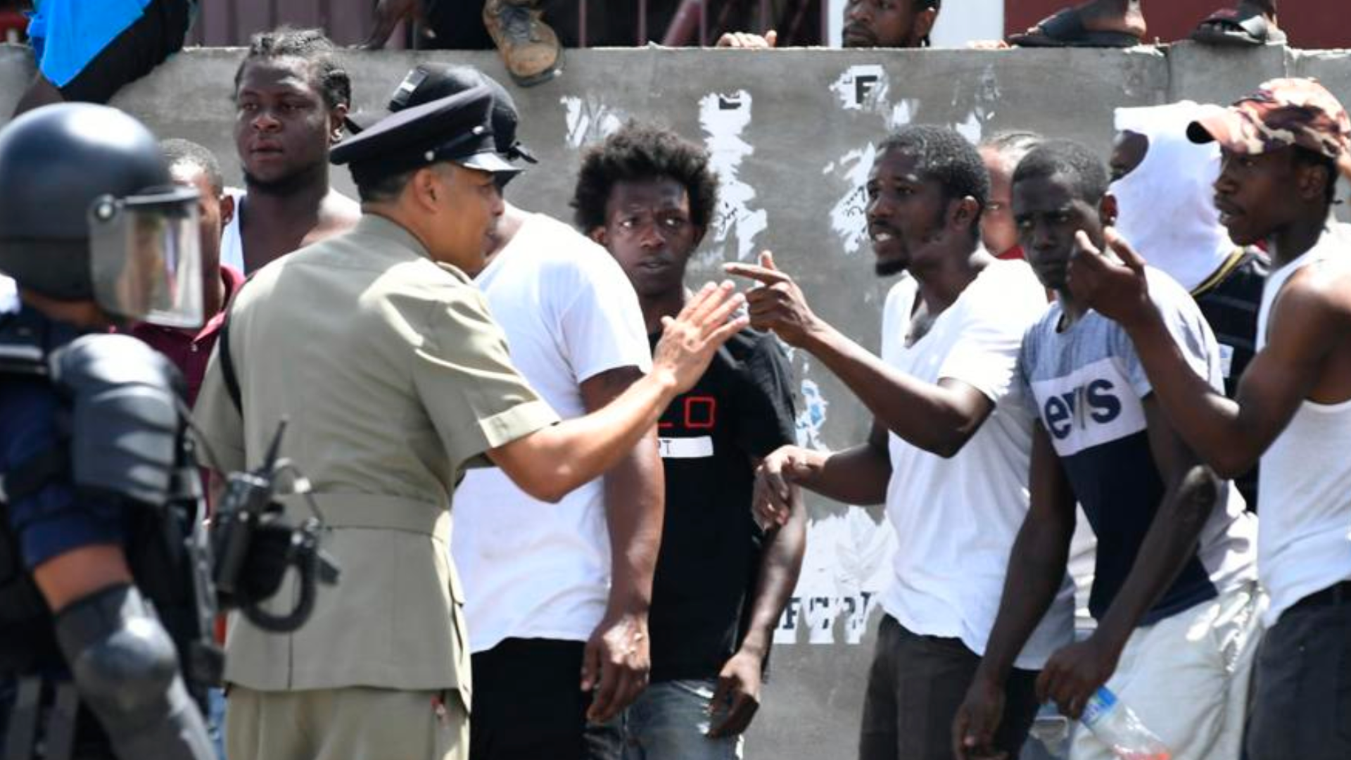 police and people argue featured